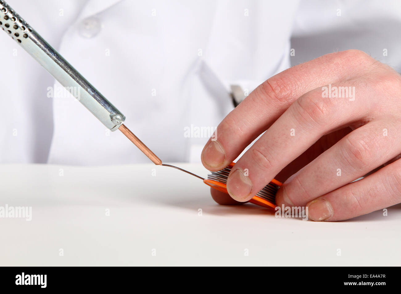 soldering iron in his hand Stock Photo - Alamy