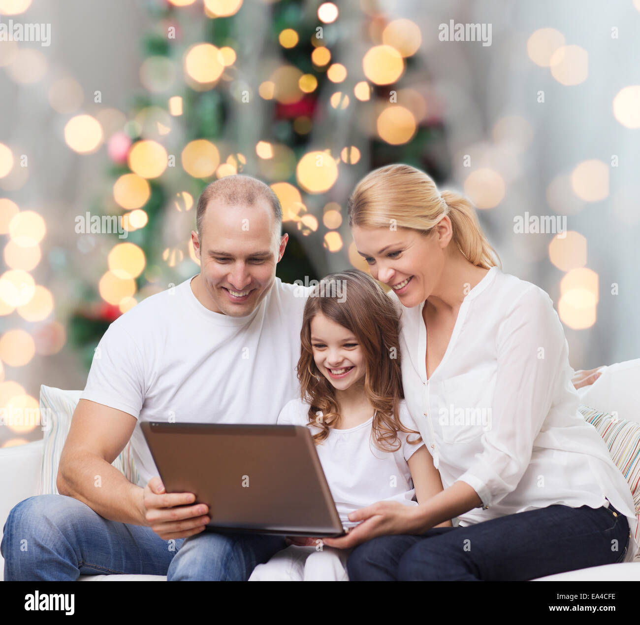 smiling family with laptop Stock Photo - Alamy