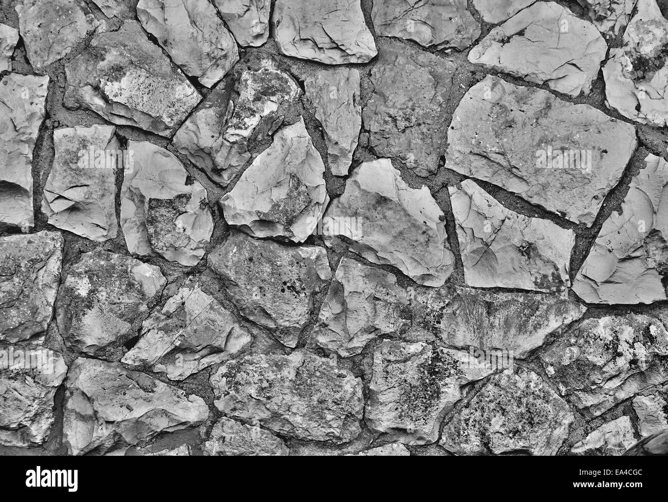Texture of old vertical stone wall in black and white Stock Photo - Alamy