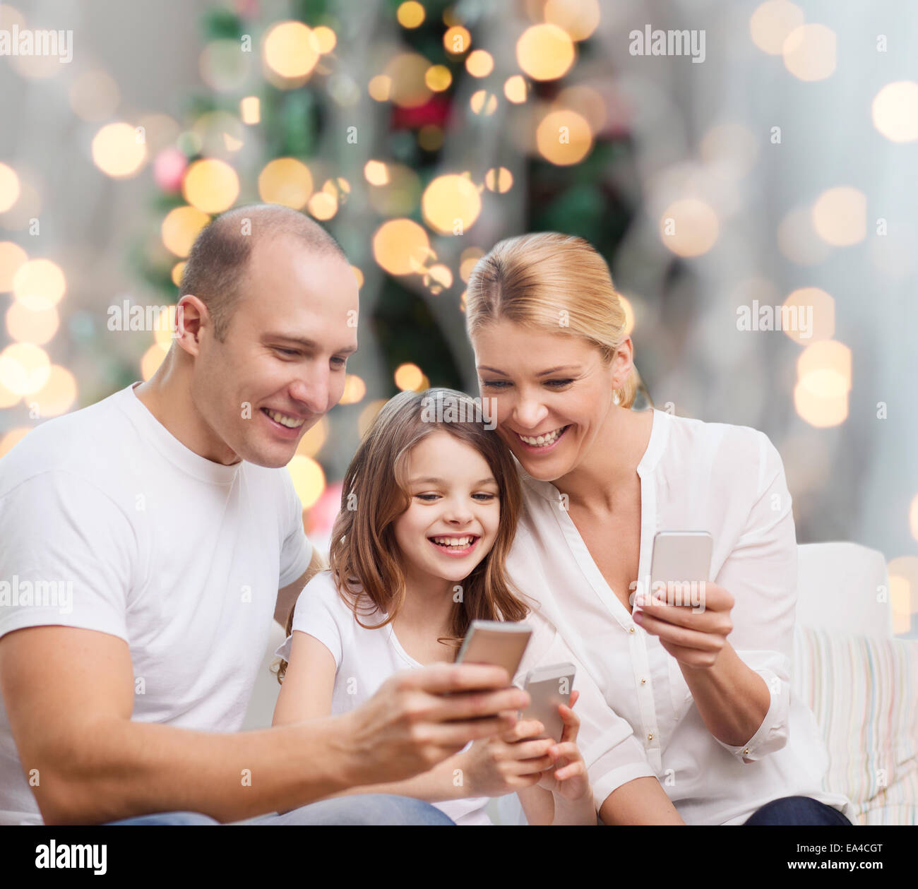 happy family with smartphones Stock Photo - Alamy
