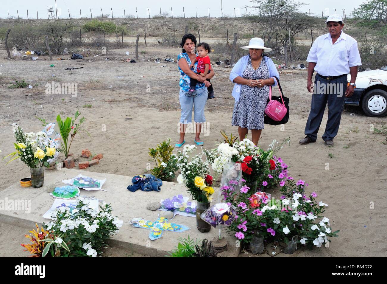 Praying - Day of The Dead - Cemetery in PUERTO PIZARRO . Department of ...