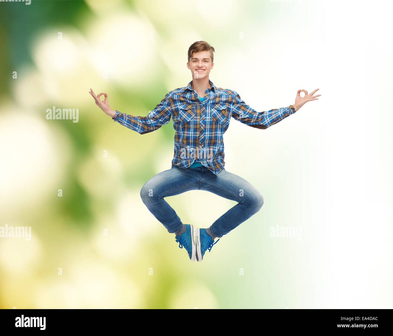 smiling young man jumping in air Stock Photo - Alamy