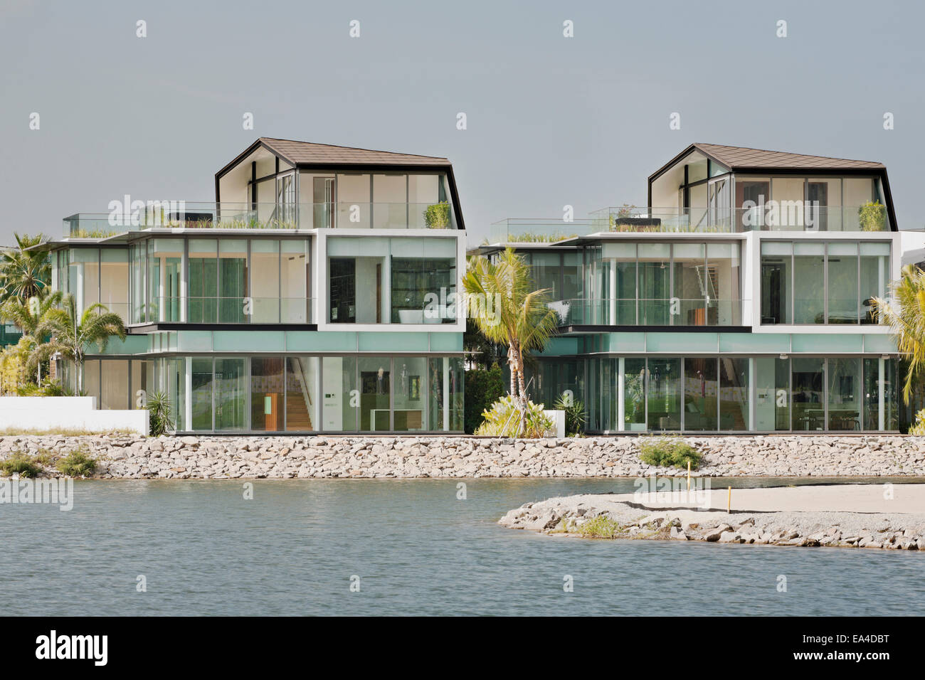 Modern residential exterior on artificial lake in Sentosa Island ...