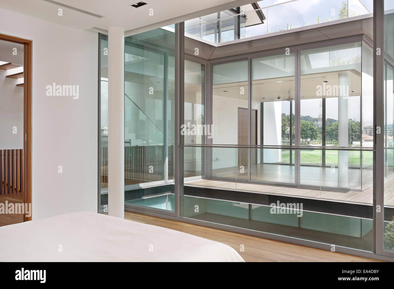 Glazed internal water feature in residential house on Sentosa island ...