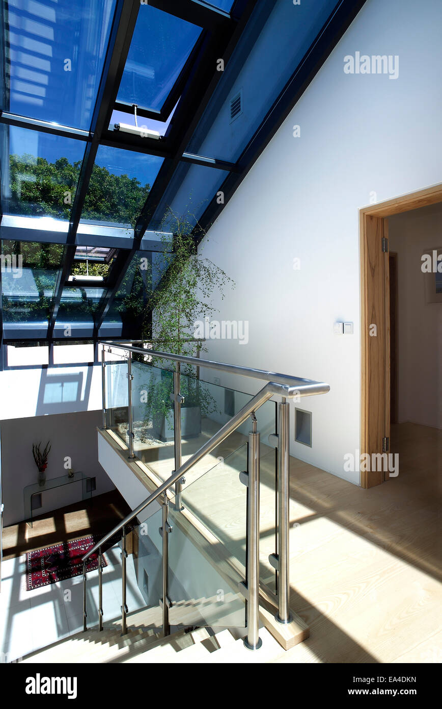 Glazed atrium and staircase in residential house, UK Stock Photo - Alamy