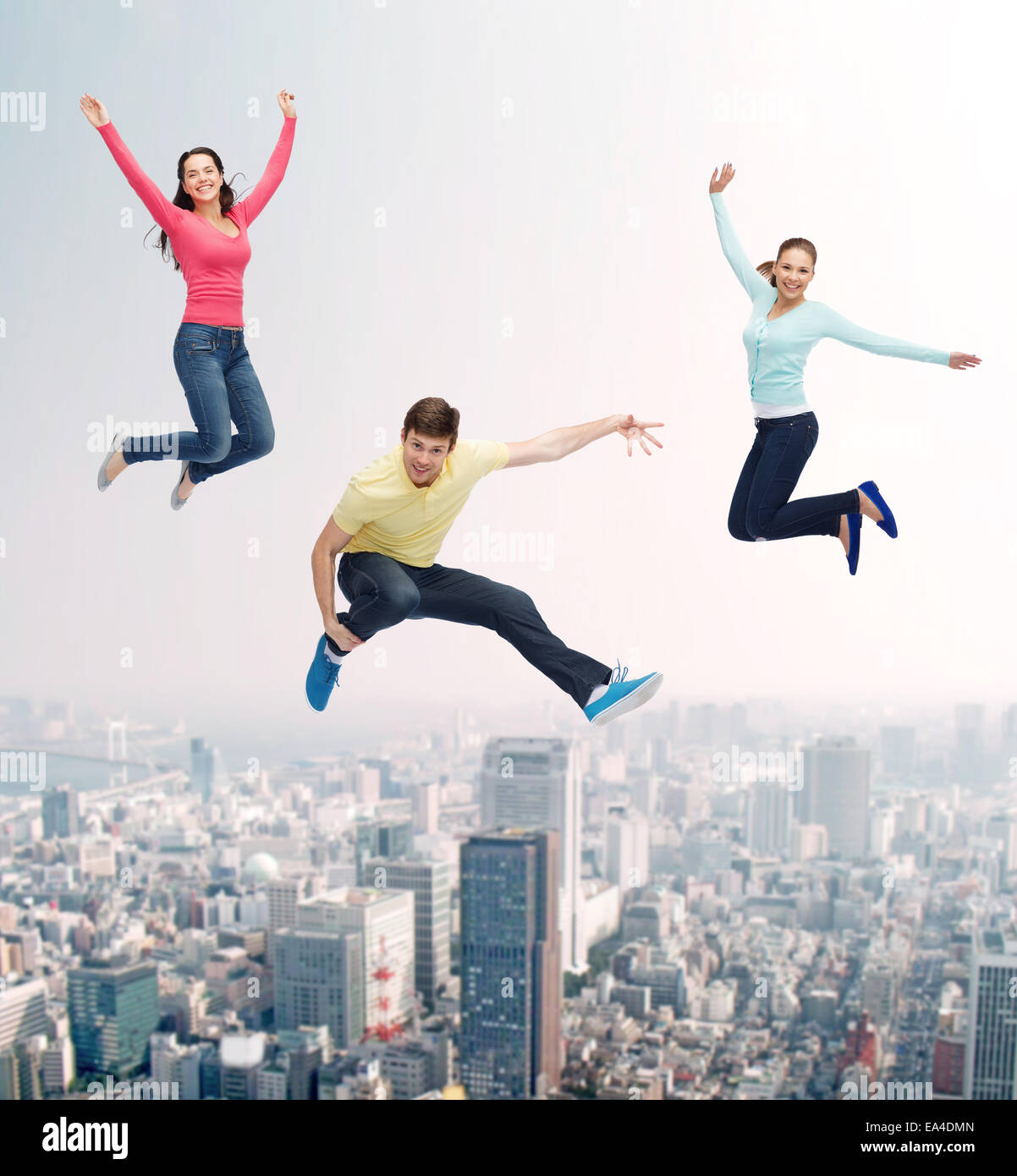group of smiling teenagers jumping in air Stock Photo - Alamy