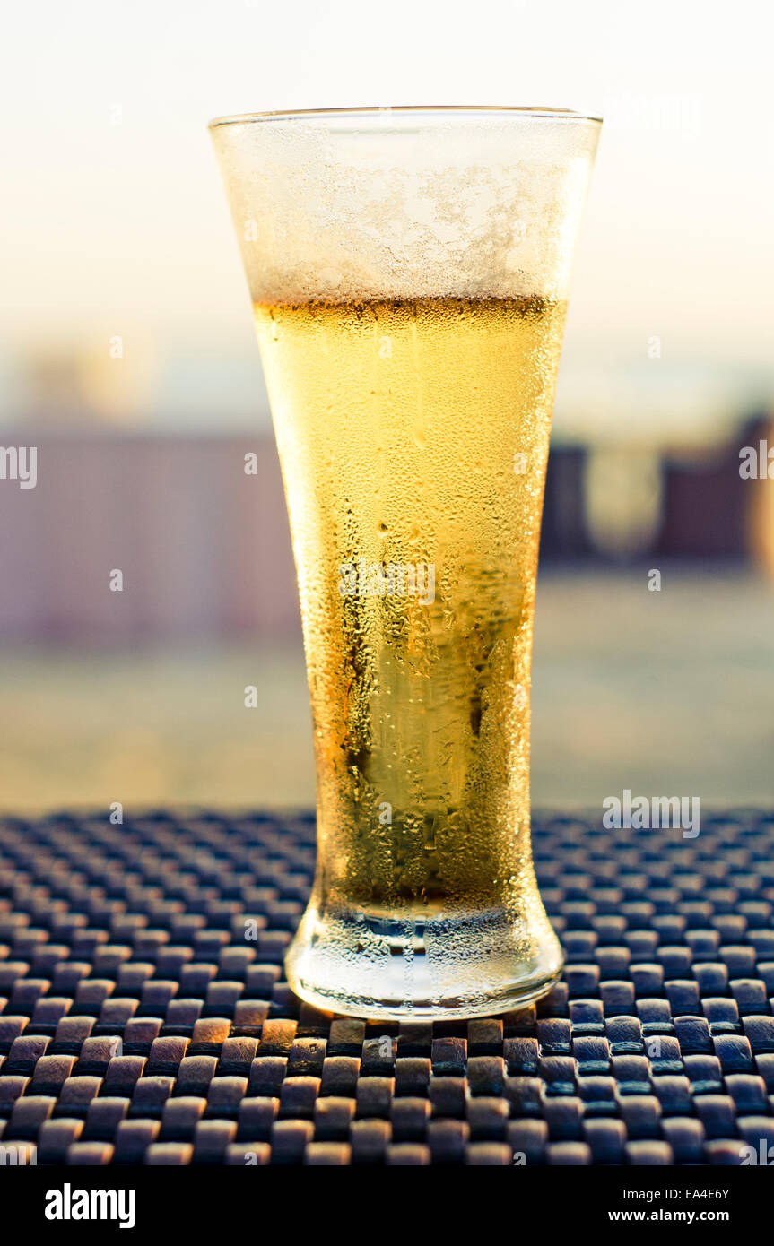 cold beer on beach, in a long glass Stock Photo - Alamy