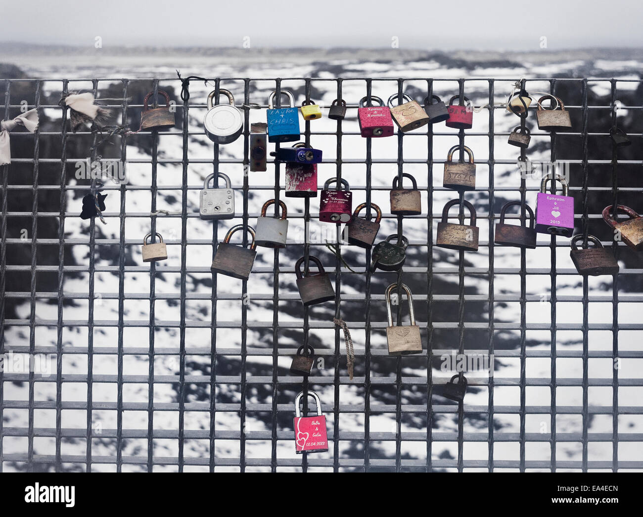 Locks placed on a chain link fence on Leif the Lucky Bridge; Reykjanes ...