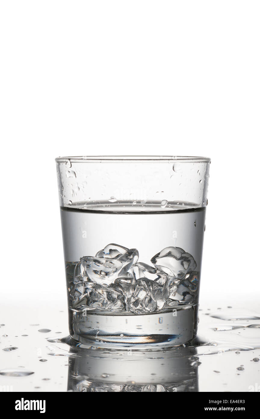 glass full of fresh water with ice cubes, on white background Stock ...