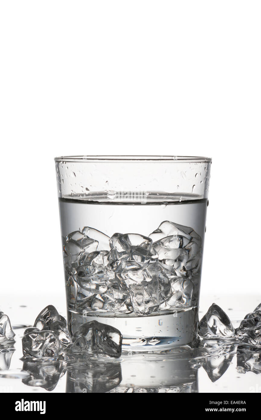 glass full of fresh water with ice cubes, on white background Stock Photo - Alamy