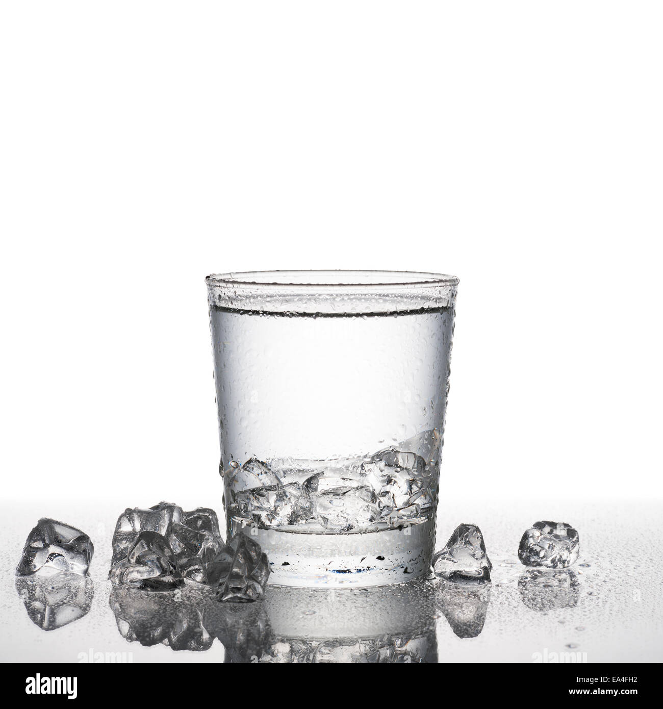 glass full of fresh water with ice cubes, on white background Stock ...