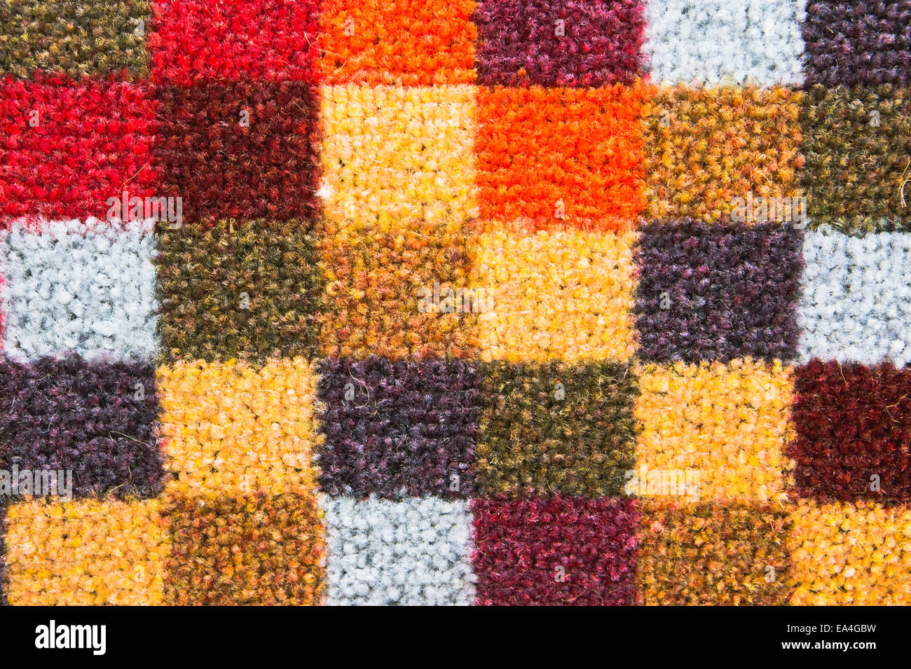 Colorful checked pattern on a carpet Stock Photo - Alamy