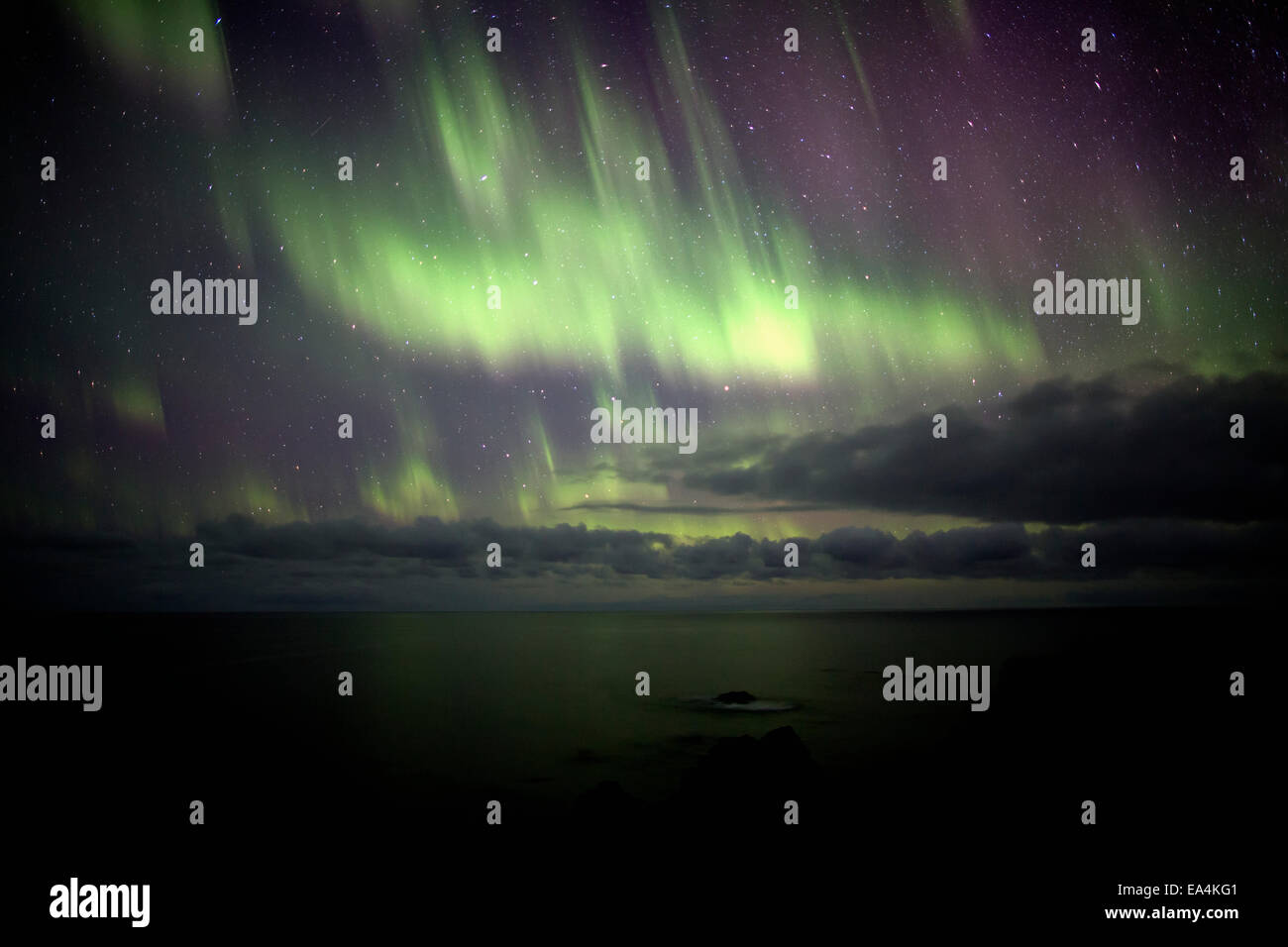 Dramatic scene of the northern lights showing the Atlantic Ocean off ...