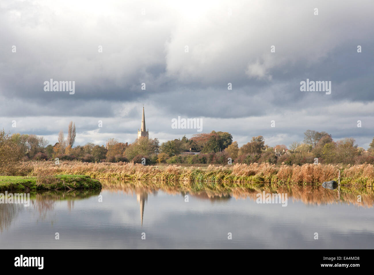 The spire of St Lawrence Church in Lechlade on Thames reflected in the ...