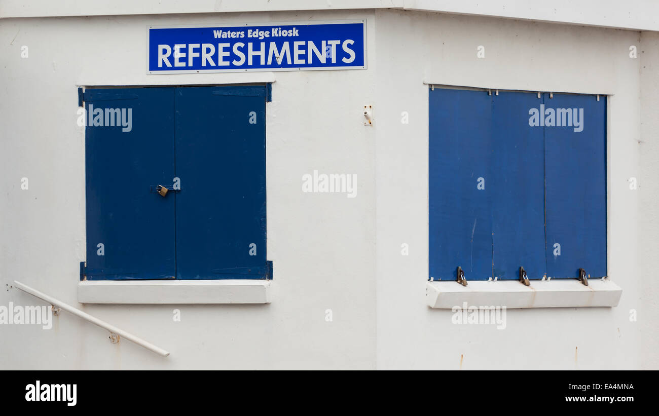 Closed windows with shutters (blue) of the refreshment kiosk ...