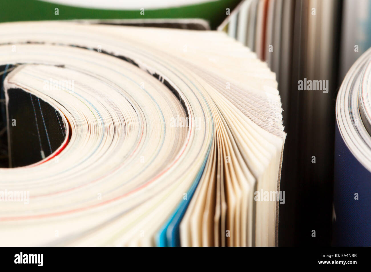 Stack of color magazines on white background Stock Photo - Alamy