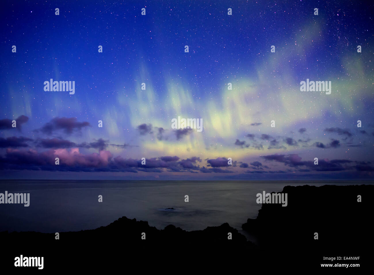 Dramatic scene of the northern lights showing the Atlantic Ocean off ...