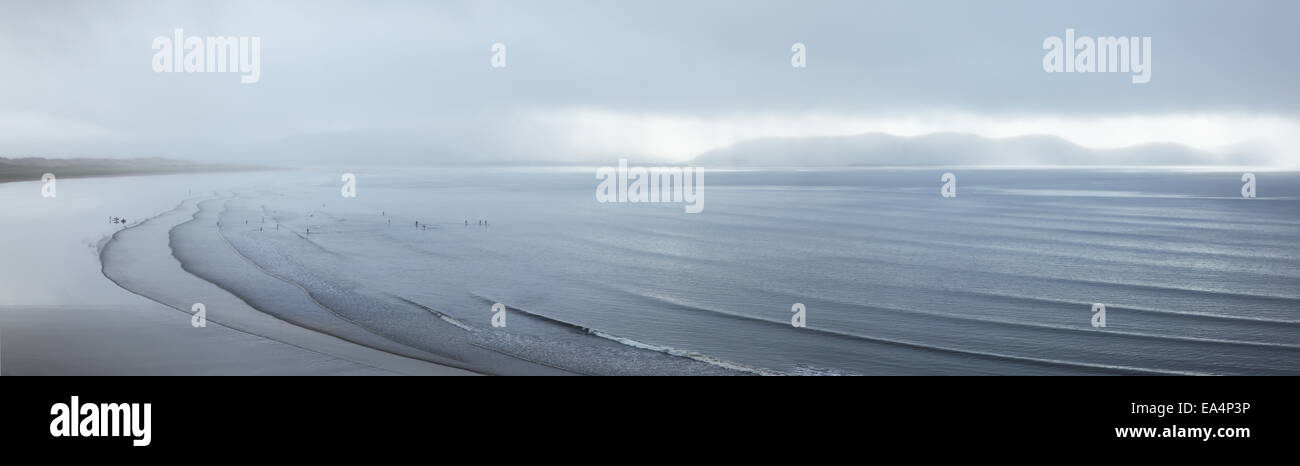 Ripples of water coming into the shore in the fog; Inch, County Kerry ...
