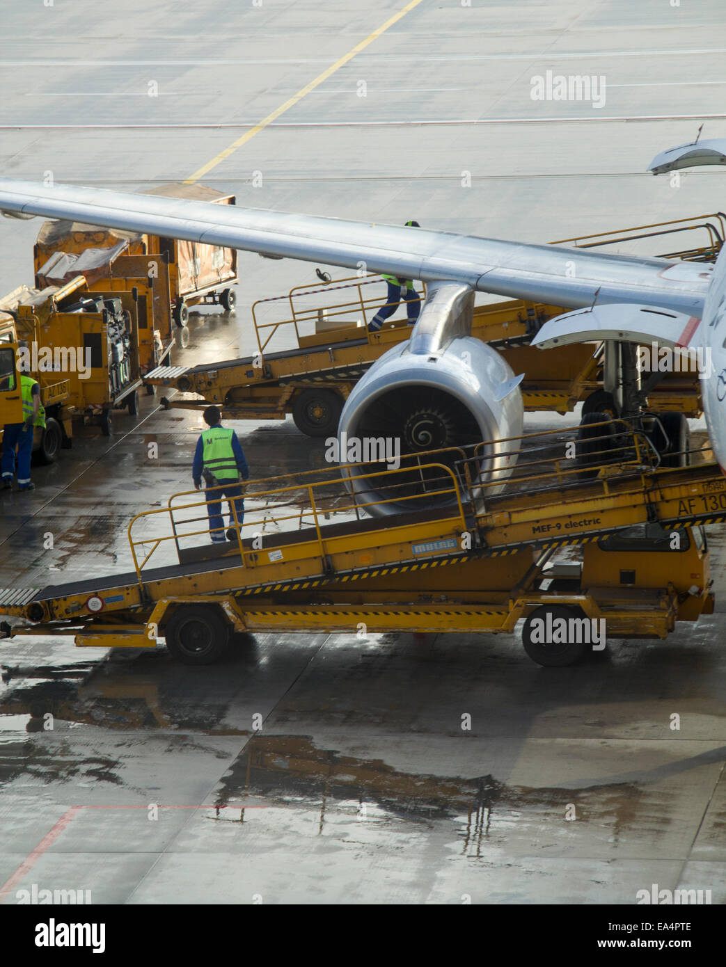Munich, Germany - October 16, 2014: Ground crew working below a ...