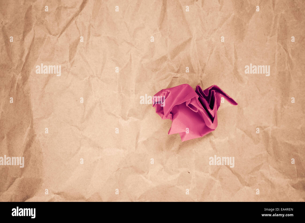 balled up recycled paper on a crumpled paper surface Stock Photo - Alamy