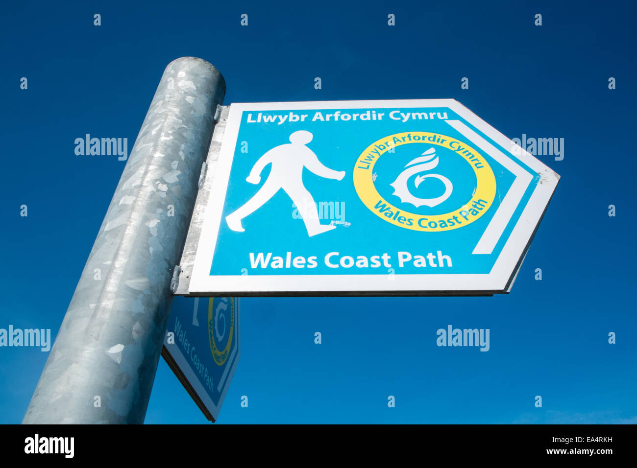 Wales Coast Path signpost in two languages,Welsh and English, at the ...