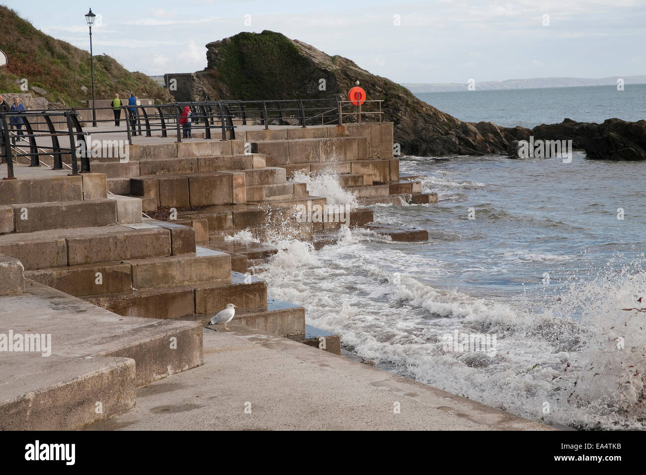 Waves lap at the steps in Looe Cornwall Stock Photo - Alamy