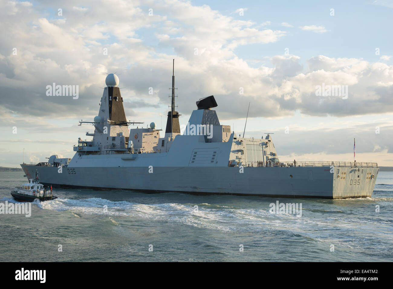 An evening departure from Portsmouth, UK for the British Royal Navy ...