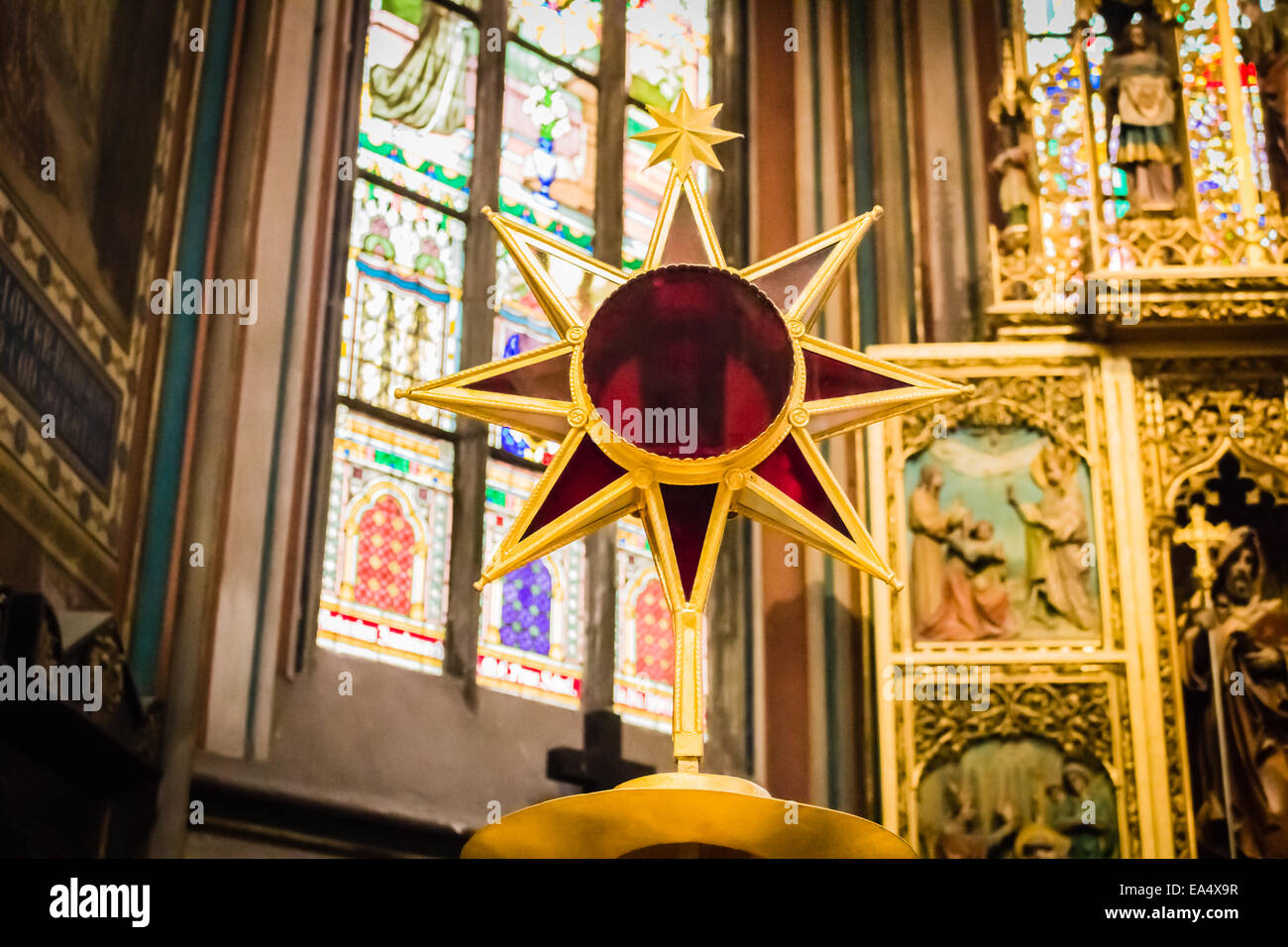 Golden altar with statues and catholic objects and symbols inside Saint ...