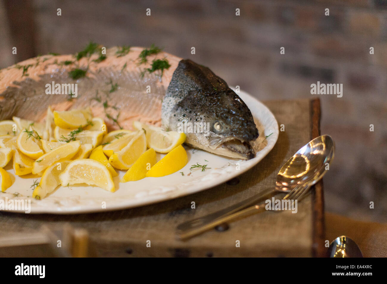 Poached salmon with lemon chunks Stock Photo - Alamy
