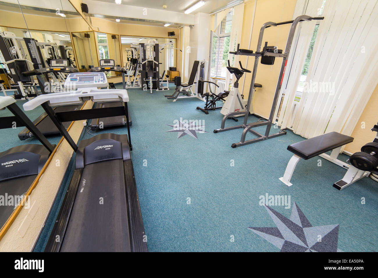 Traineger equipments in fitness center, gym Stock Photo - Alamy