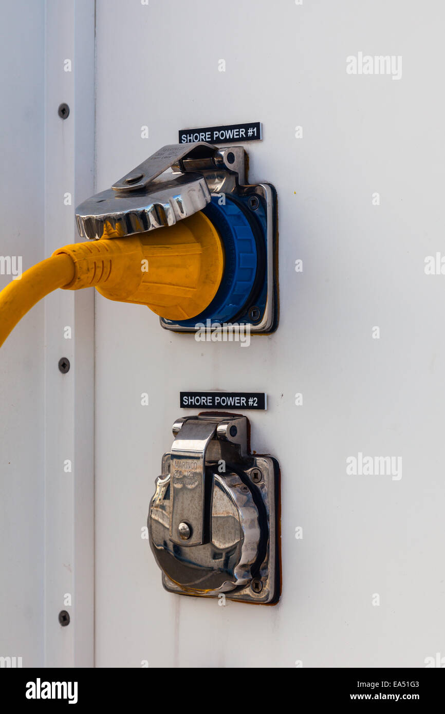 Abstract image of a shore power cable connected to a motor vessel Stock ...
