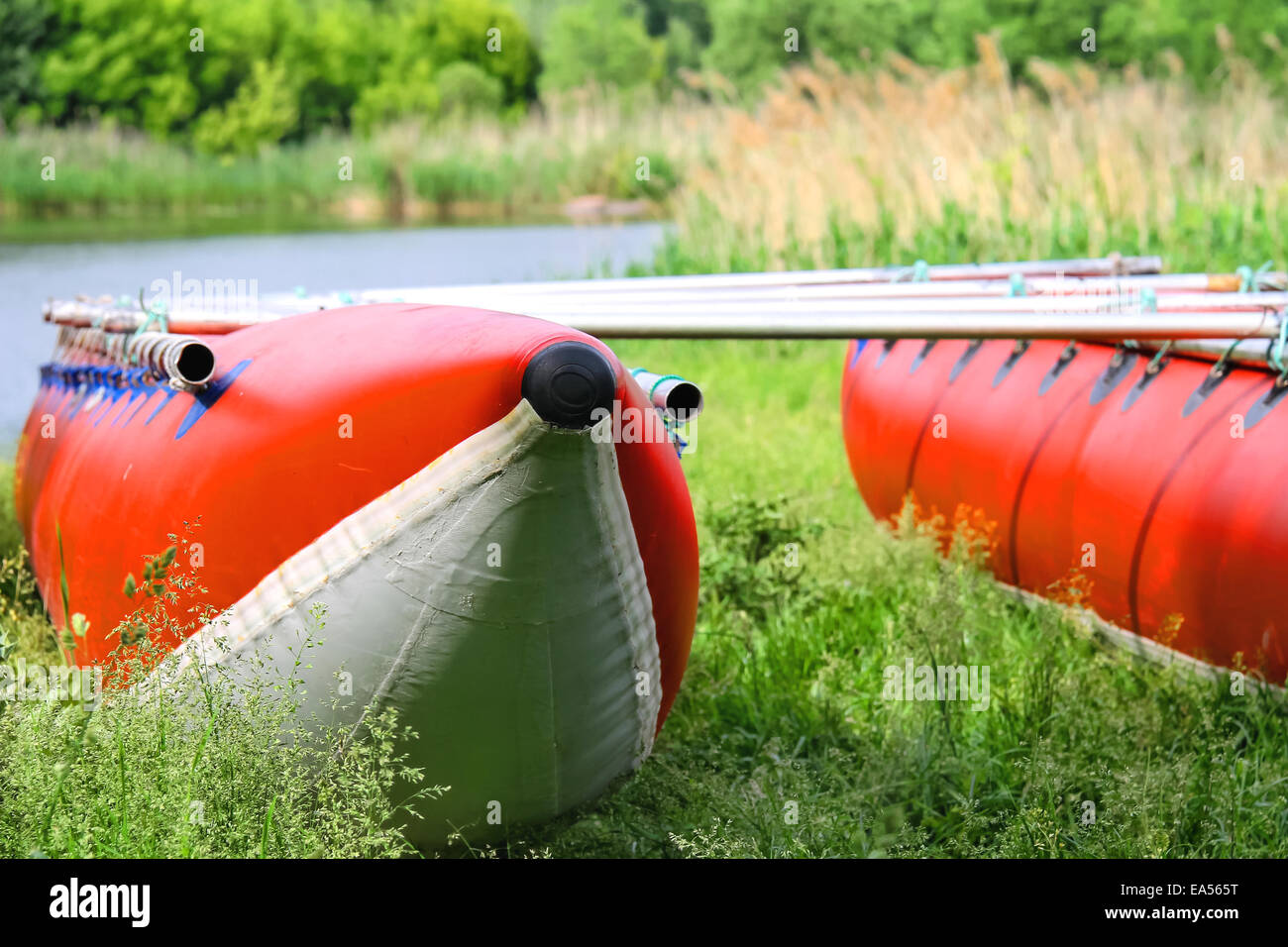 Catamarans for rafting on the river bank Stock Photo - Alamy