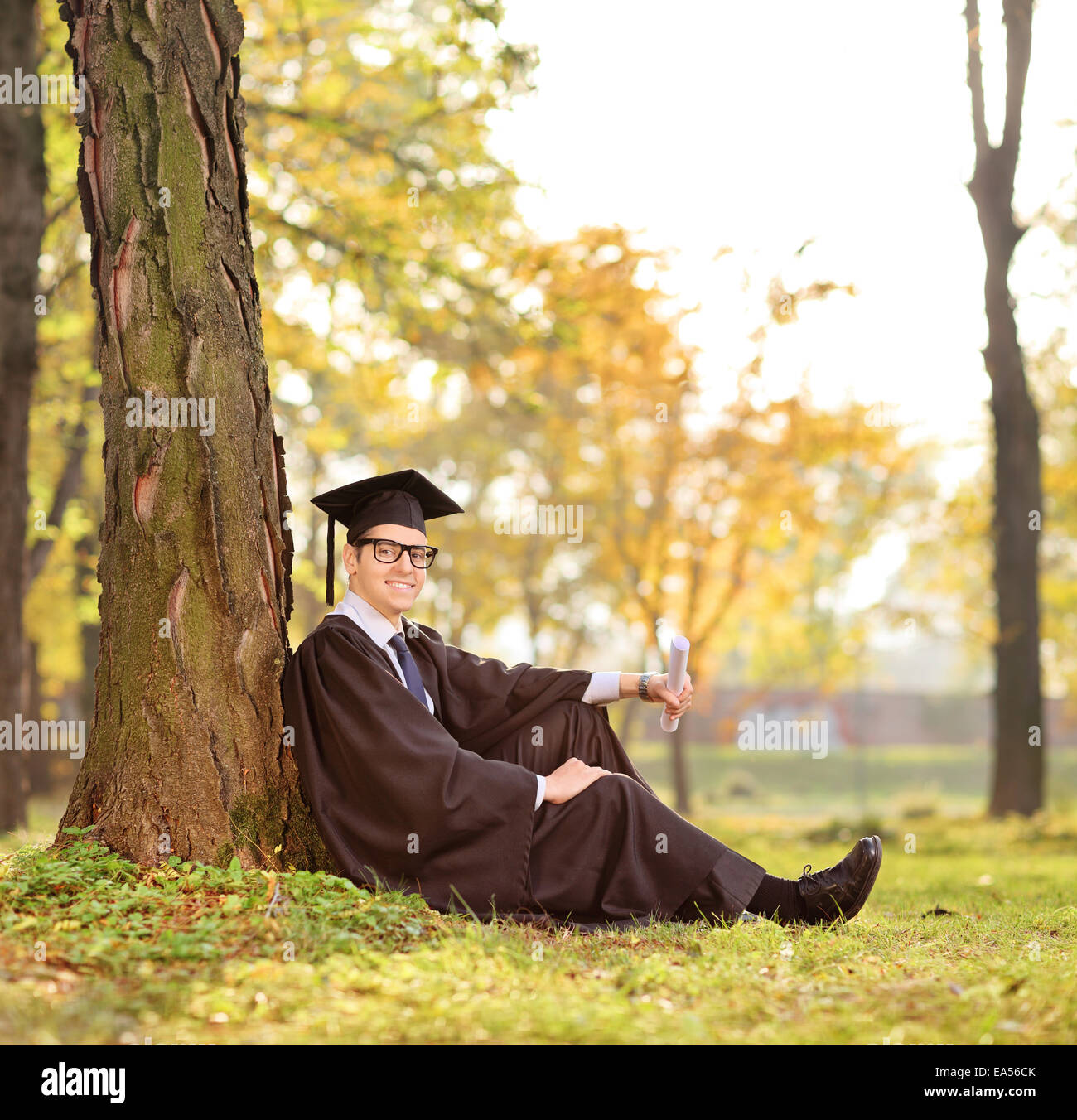 Male college graduate posing outdoors hi-res stock photography and ...