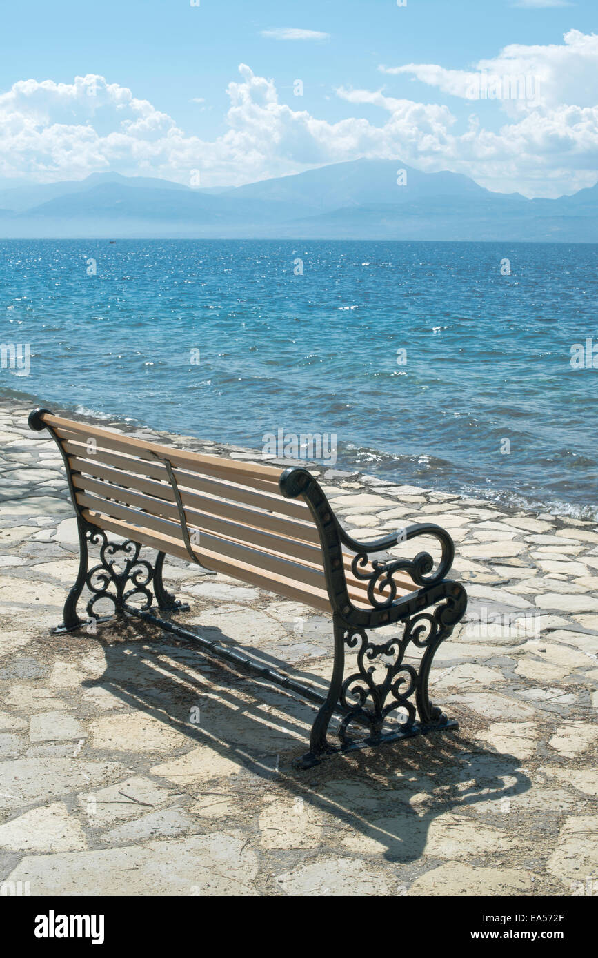Bench on the beach. Blue sky Stock Photo - Alamy