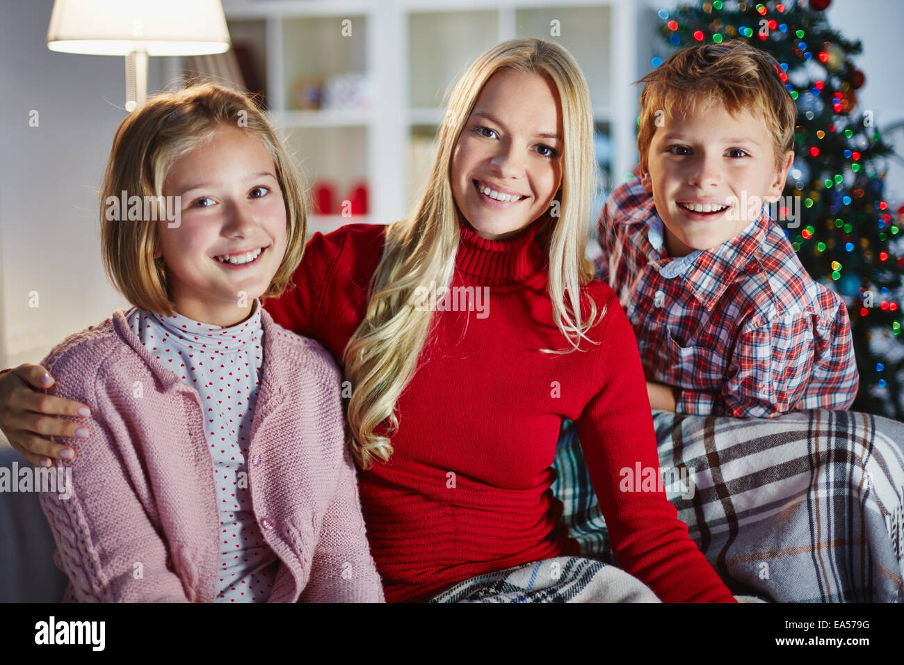 Family having rest at home on Christmas evening Stock Photo - Alamy