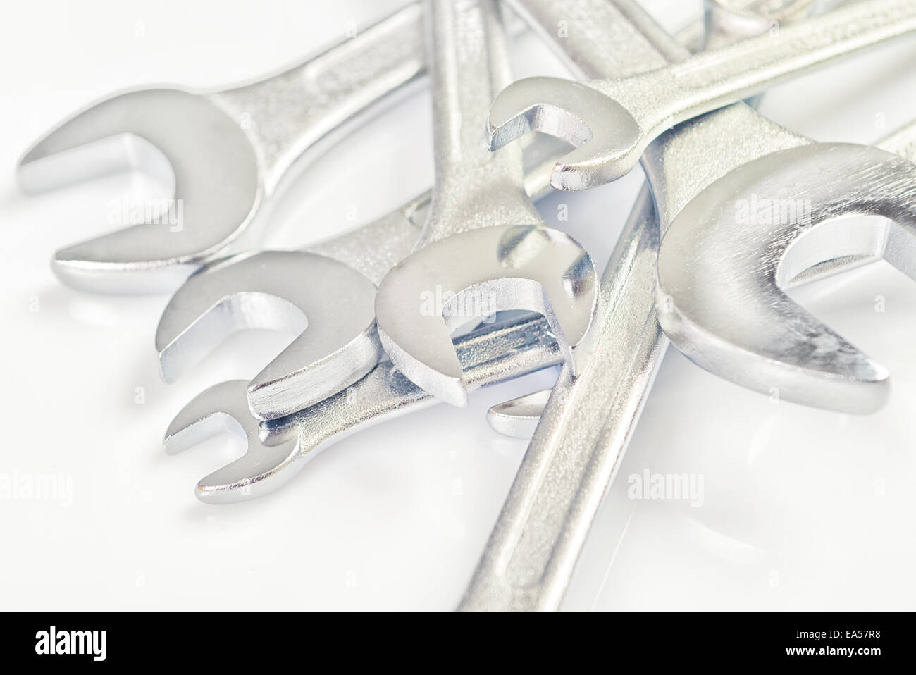 Wrench Jaw Spanner Tools Piled on workshop table Stock Photo - Alamy