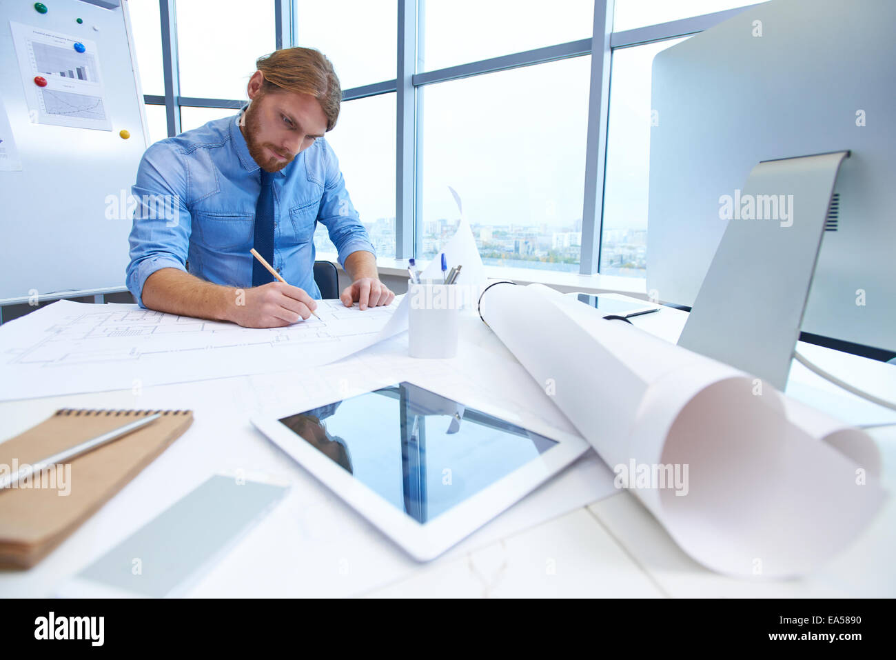 Modern architect drawing new sketch in office Stock Photo - Alamy