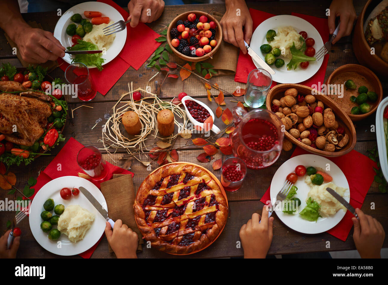 Hands of people over plates with festive food Stock Photo - Alamy