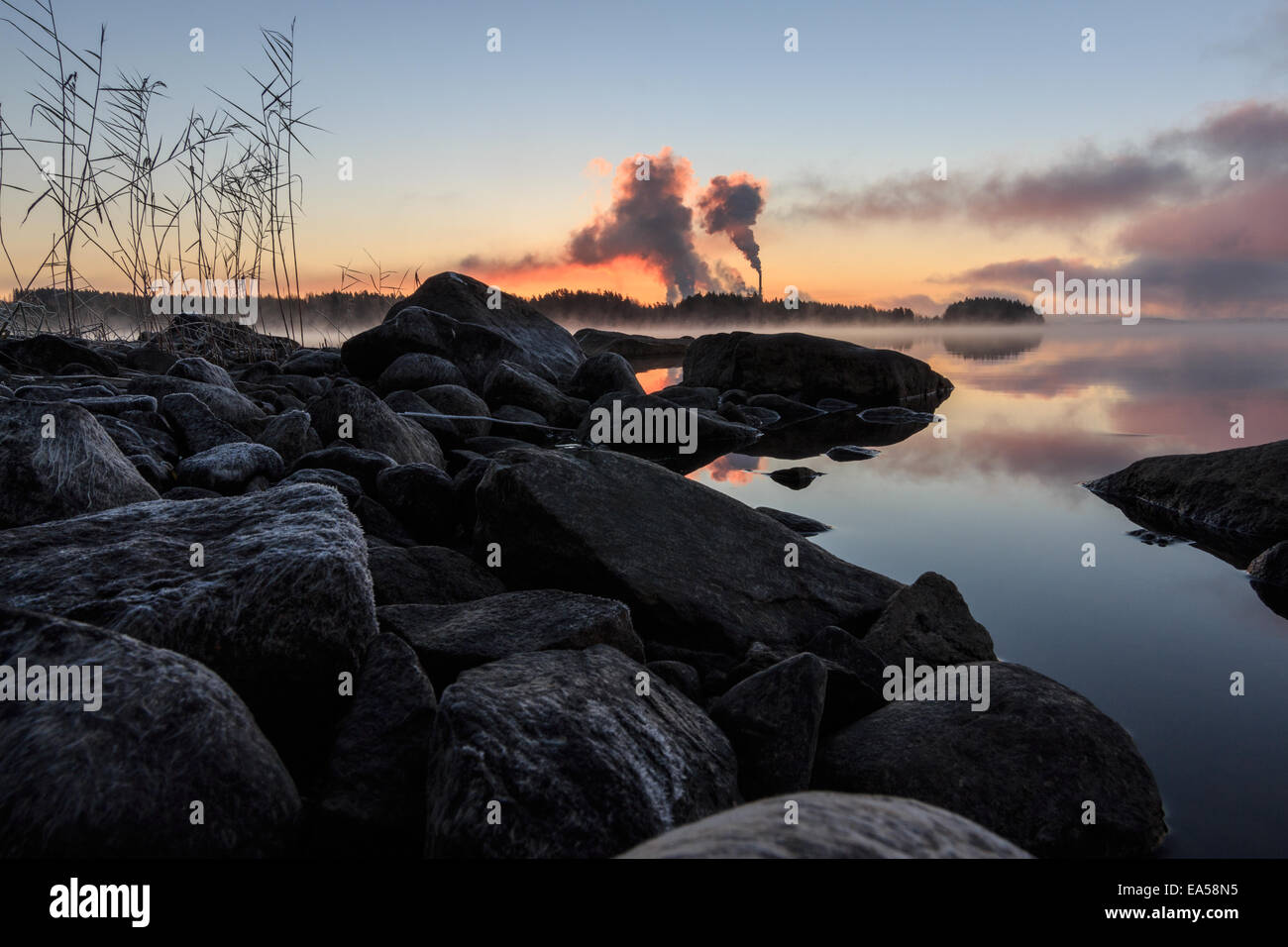 Cold and calm morning by the lake just before sunrise Stock Photo - Alamy