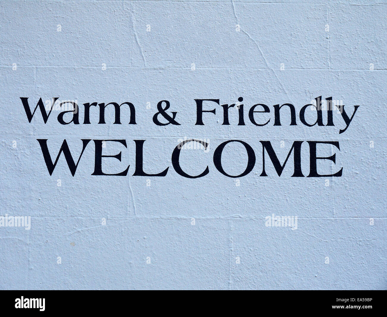 Warm & Friendly Welcome sign painted on outside wall Manchester UK ...