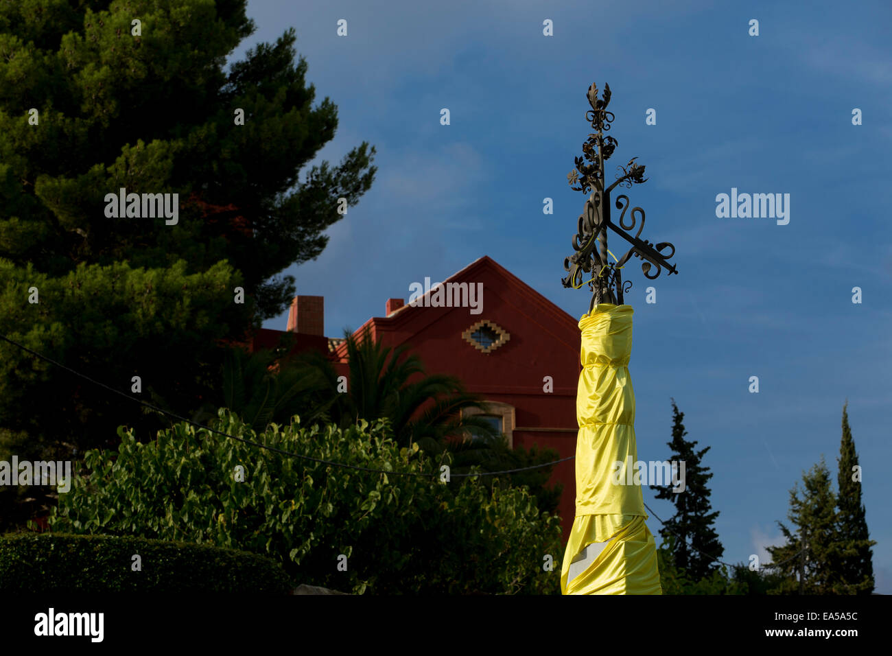Valls, Spain. Monument wrapped with a yellow fabric. Campaign to ...