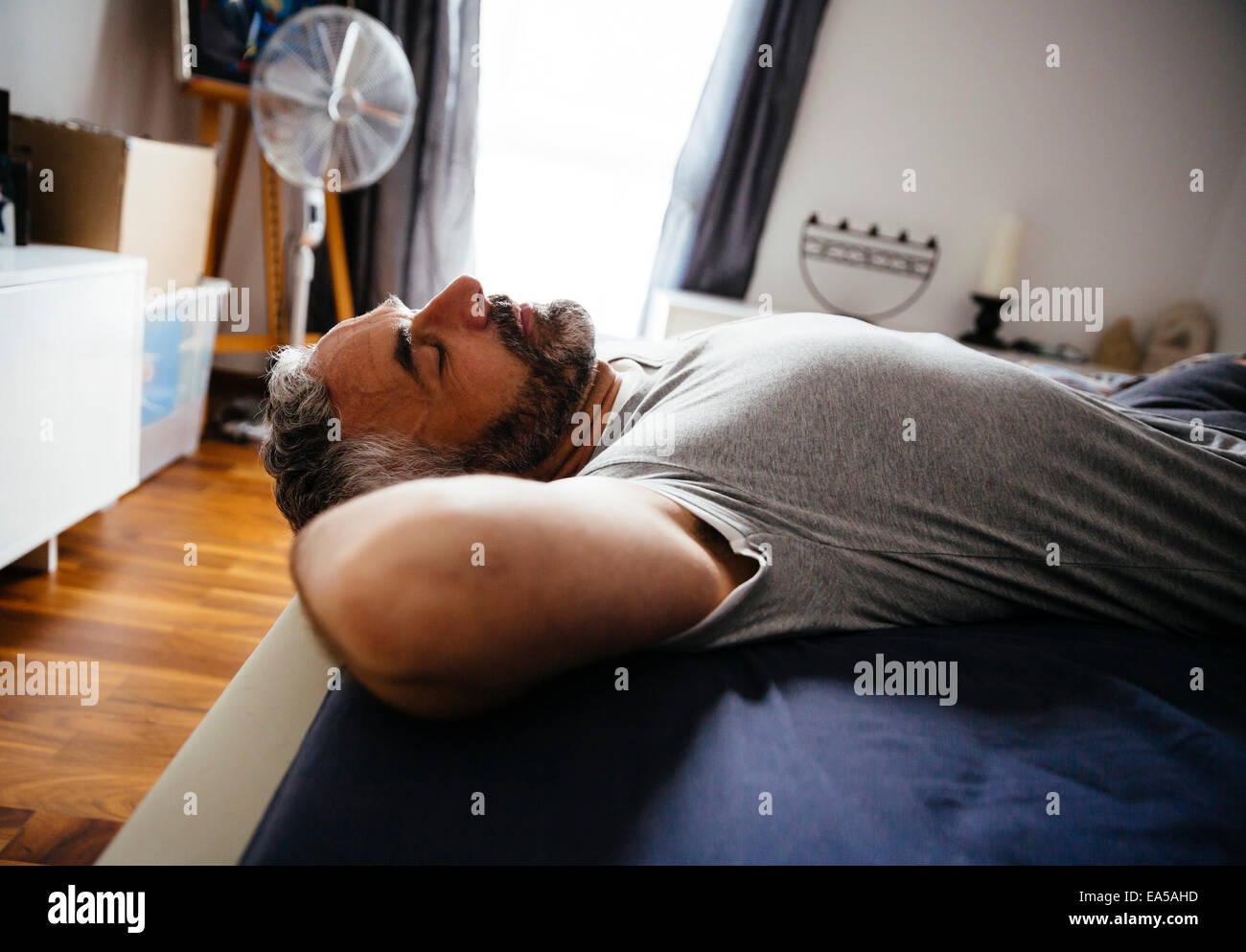 Man sleeping bed grey hair hi-res stock photography and images - Alamy