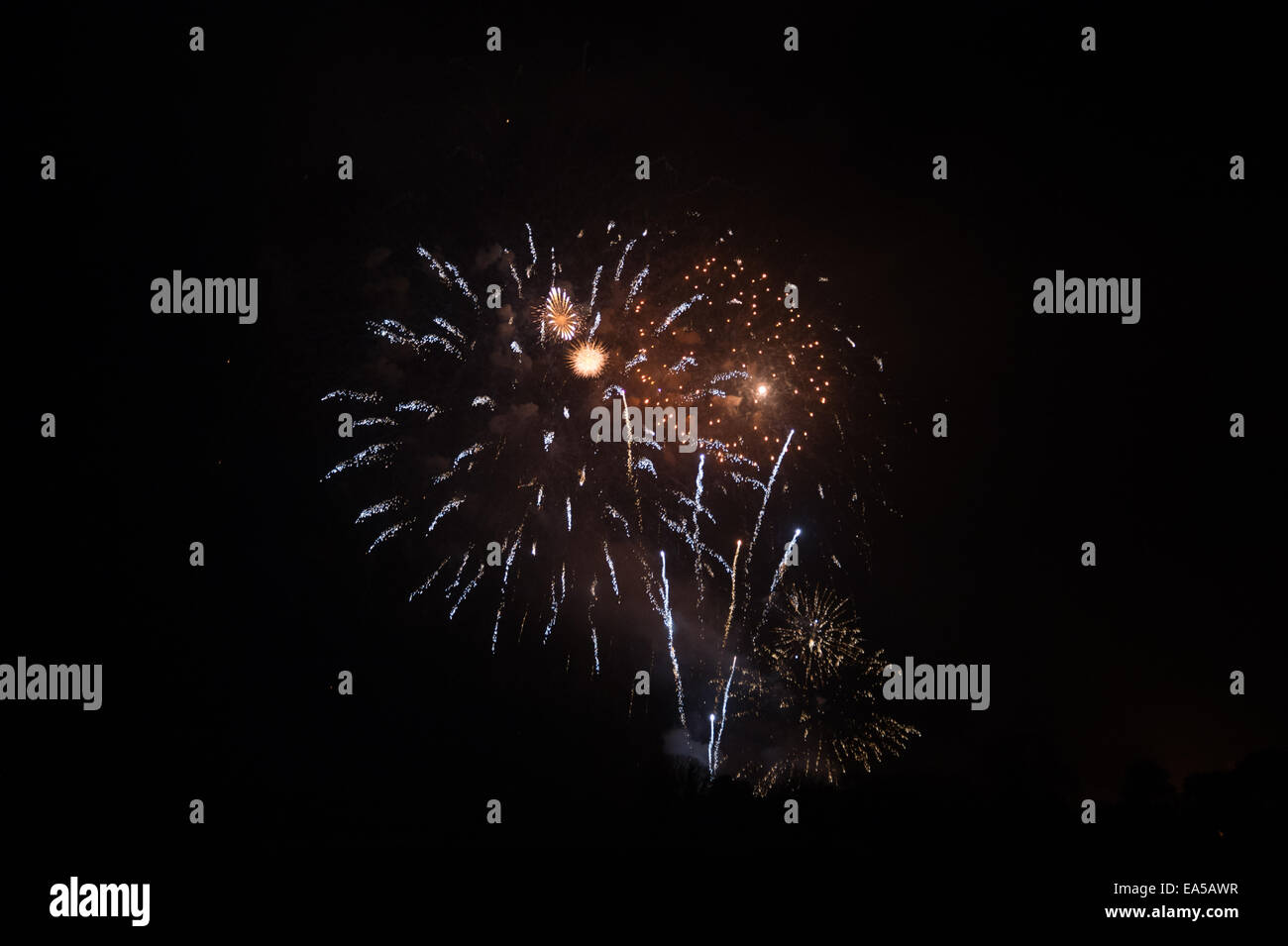 Lewes Bonfire night. A firework display is reflected in the River Ouse ...