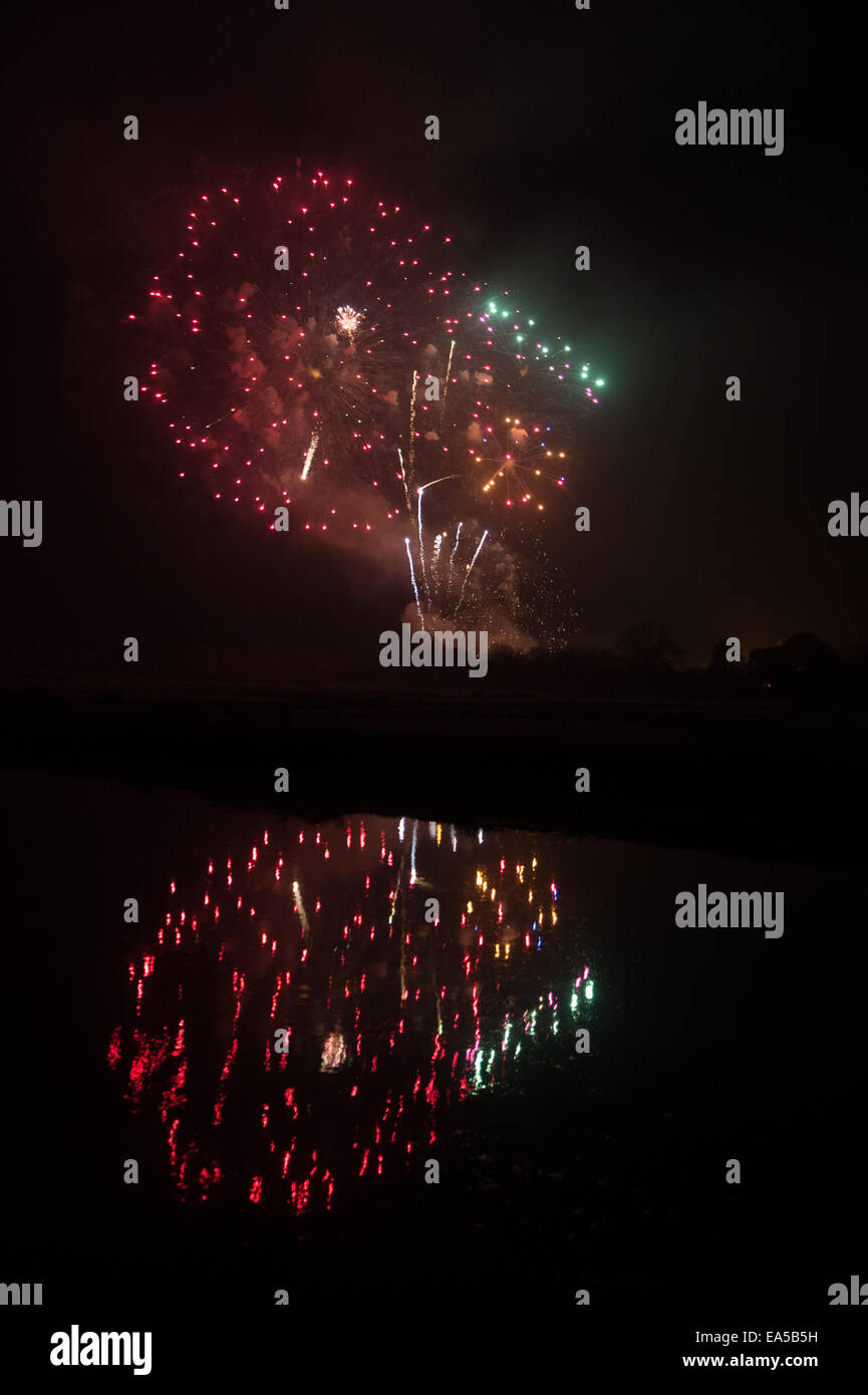 Lewes Bonfire night. A firework display is reflected in the River Ouse ...