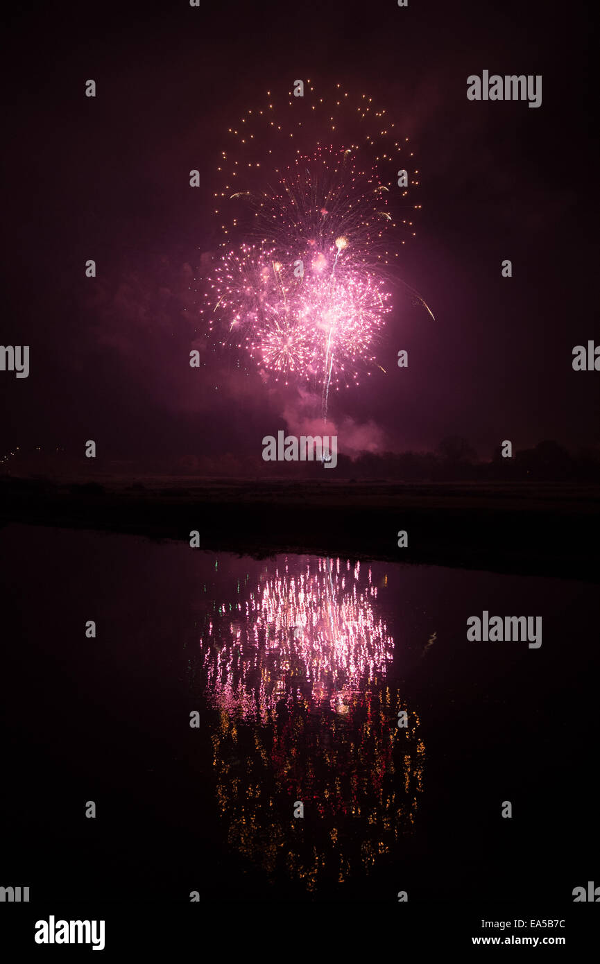 Lewes Bonfire night. A firework display is reflected in the River Ouse ...