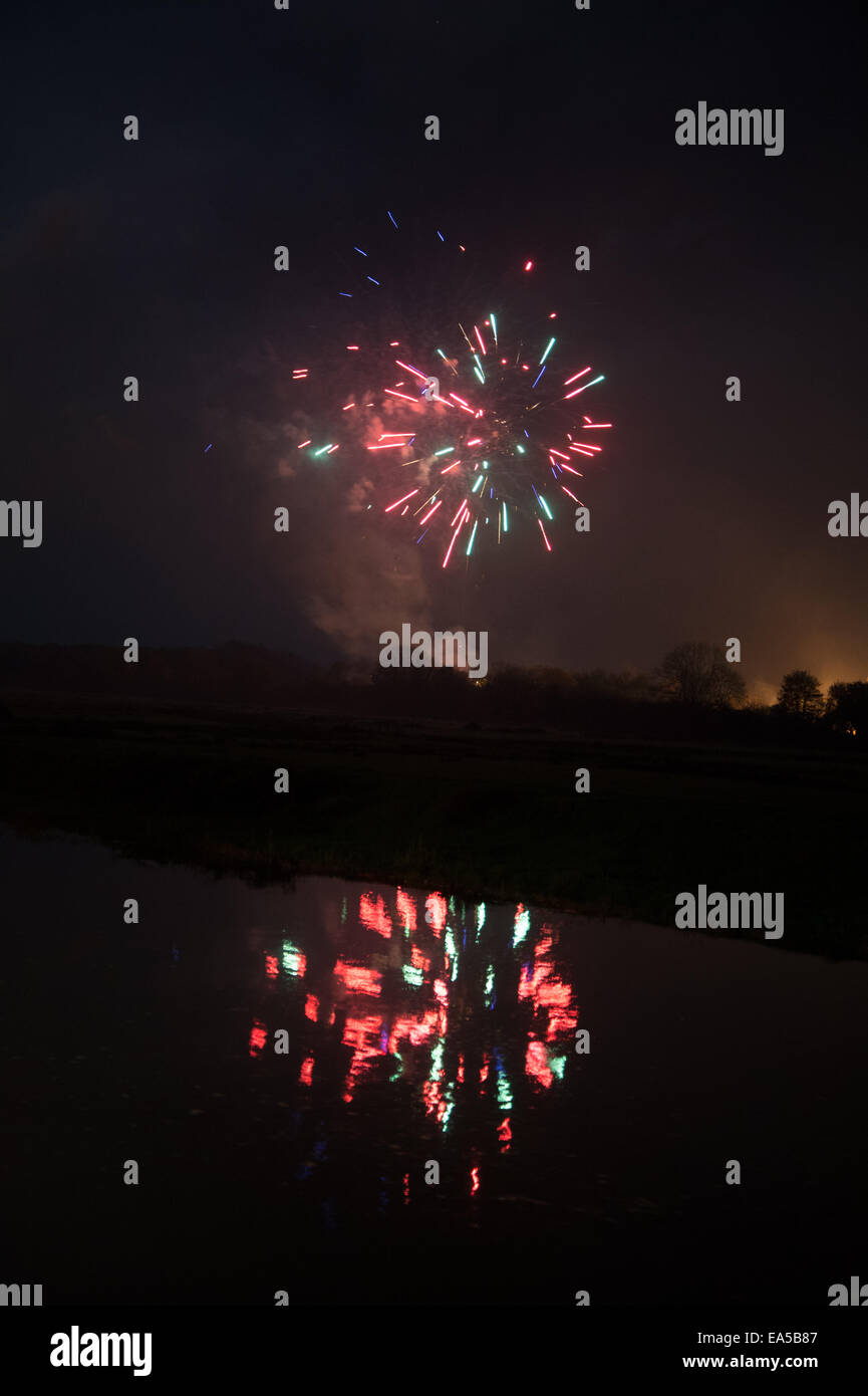 Lewes Bonfire night. A firework display is reflected in the River Ouse ...