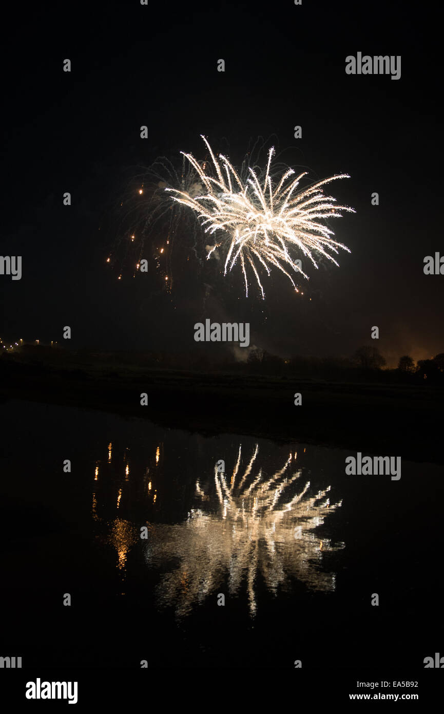 Lewes Bonfire night. A firework display is reflected in the River Ouse ...