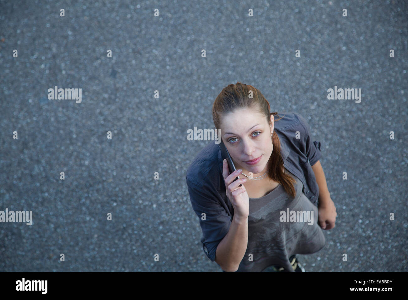 Young woman telephoning with smartphone, view from above Stock Photo ...