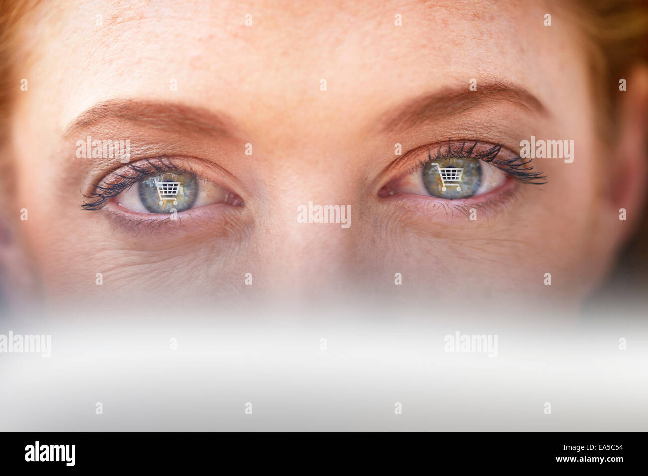 Woman's eyes withshopping cart icons Stock Photo - Alamy