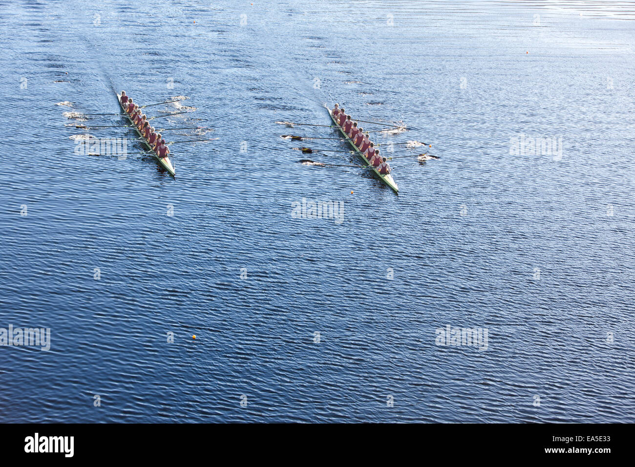 Elevated view of two rowing eights in water Stock Photo - Alamy